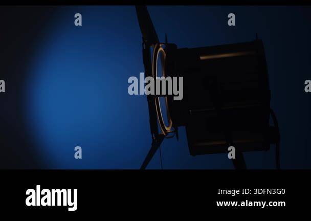 A spotlight with a soft, warm light is angled toward the camera ...