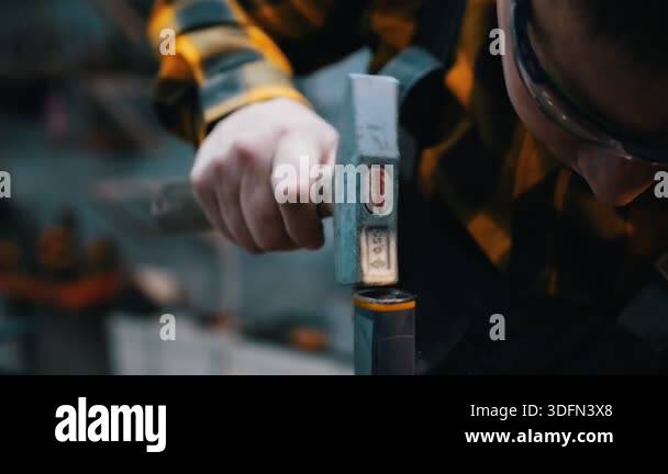 Carpentry industry - a man woodworker cutting out the recess on the ...