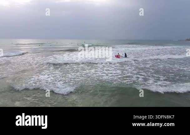 November 22, 2025, Spain, Alikte, San Juan beach, Surfers in wetsuits ...