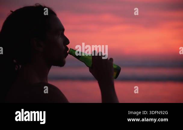Man Drinking Beer at Summer Sunset of Sea Beach or Ocean Water Close Up ...