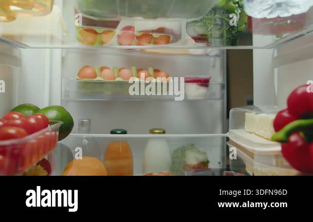 Woman and Girl Opening Fridge Door with Healthy Food and Taking ...