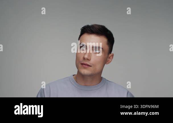 Portrait of Young Man Looking up in Color Studio Shot. Adult Boy ...