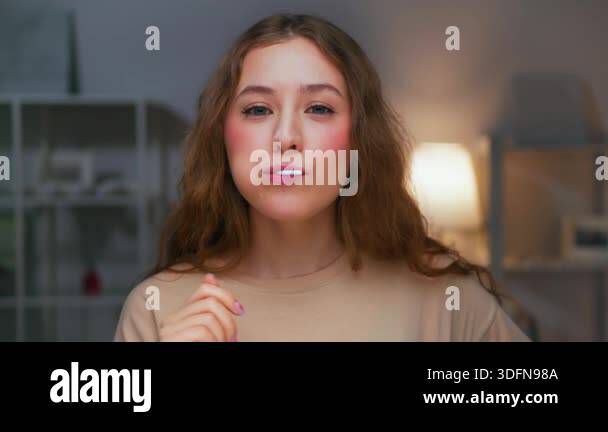 Portrait of Young Woman Eating Sweet Food and Looking at Camera Close ...