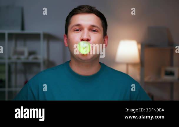 Portrait of Young Man Chewing Bubble Gum and Looking at Camera Close Up ...