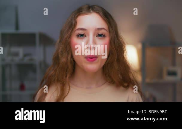 Portrait of Young Woman Chewing Bubble Gum and Looking at Camera Close ...