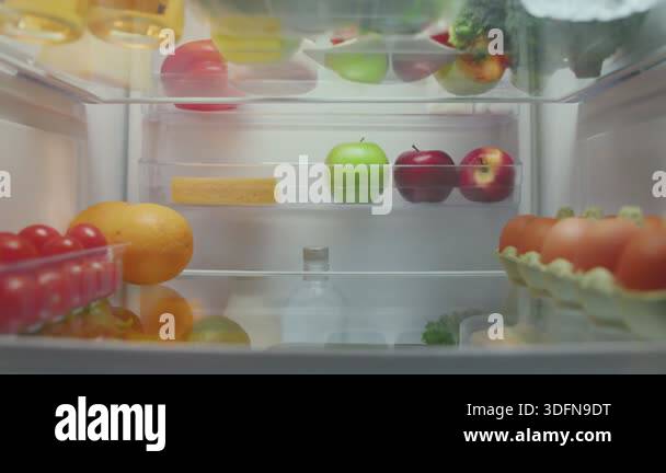 Man Opening Fridge Door with Healthy Food and Taking Products. Hungry ...