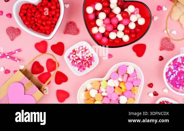 Valentines Day table scene with a variety of candies. Slow rotating ...