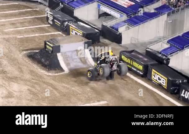 Orlando, Florida, USA - 03.02.2024: A yellow monster truck jumps near ...