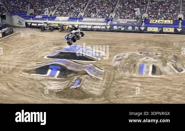 Orlando, Florida, USA - 03.02.2024: A monster truck launches high into ...