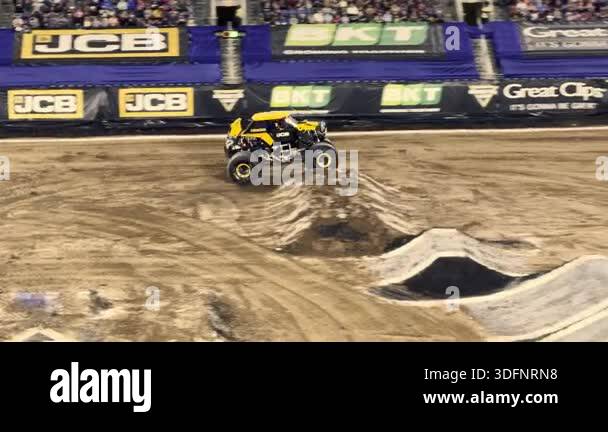 Orlando, Florida, USA - 03.02.2024: A yellow monster truck jumps over a ...