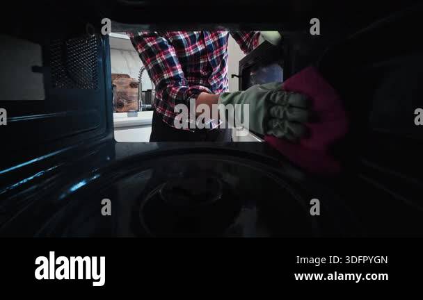 Man In Rubber Protective Gloves Cleaning The Inside Walls Of A ...