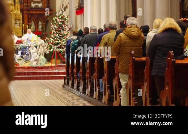 24.12.2022 Novi Sad, Serbia. Holiday Catholic service with parishioners ...
