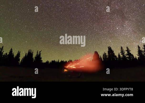 A magical animated scene of a meteorite streaking through a night sky ...