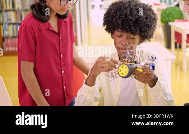 Indian, African, and mixed Asian-Caucasian students collaborate on a ...