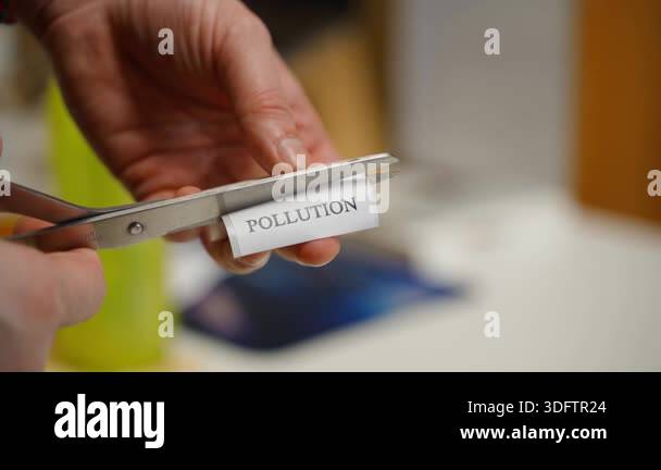 Cut out sticker with word POLLUTION, close-up. High quality FullHD ...