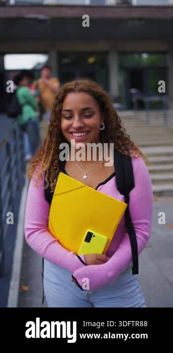 Vertical. Beautiful young african american woman with afro hair smiling ...