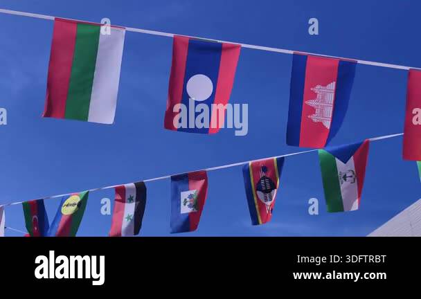 Video footage 4k. National flags of Madagascar, Laos, Cambodia, Syria ...