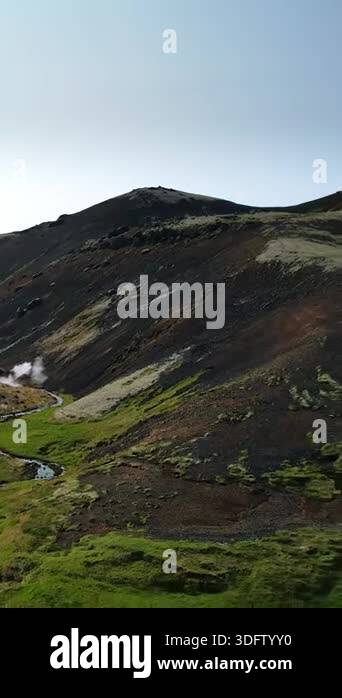Vertical video, volcanic mountain valley, Iceland landscape from height ...