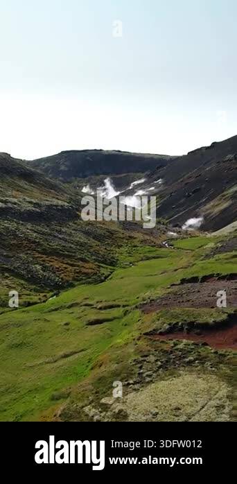 Volcanic mountain valley vertical video, Iceland landscape from height ...