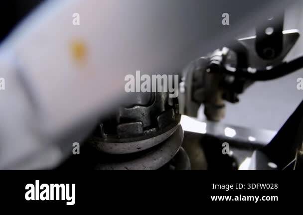Close-up of a motorcycle suspension system with a coil spring Stock ...