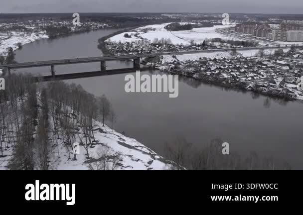 Aerial Winter River And Bridge Skyline. Snow Covered Banks And Silent ...