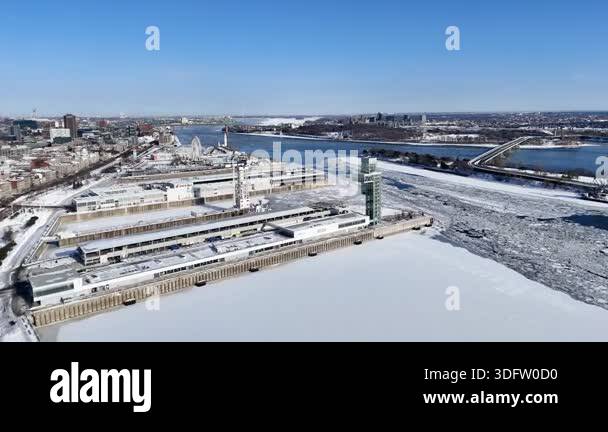Aerial winter view of Montreal Old Port and frozen St Lawrence River ...