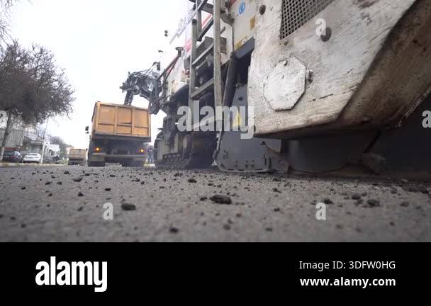 Close up of tracked construction machine, asphalt paver or road milling ...