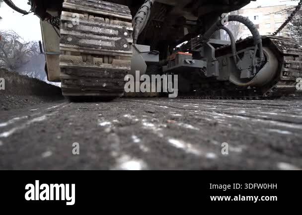 Close up of tracked construction machine, asphalt paver or road milling ...