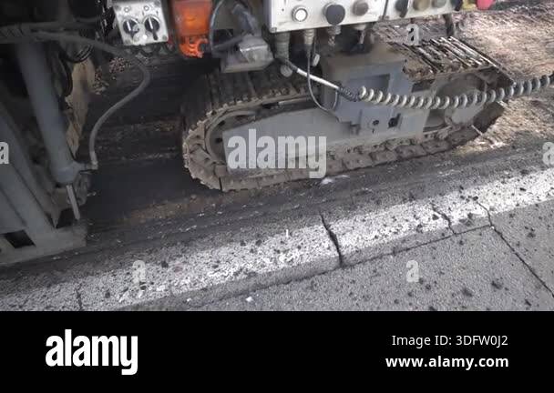 Close up of tracked construction machine, asphalt paver or road milling ...