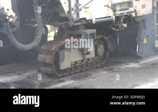 Close up of tracked construction machine, asphalt paver or road milling ...