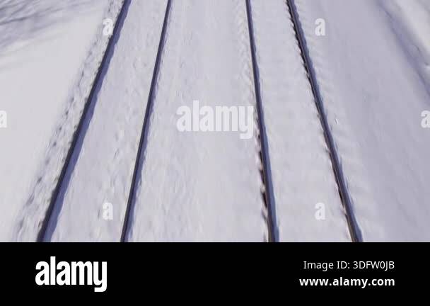 Snowy Railway Tracks Leading Toward Horizon With Parallel Rails Cutting ...