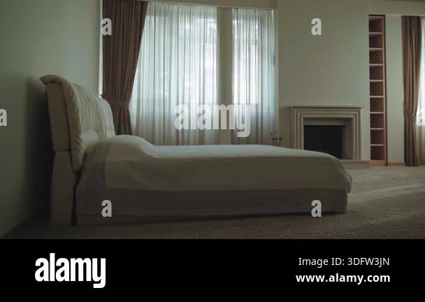 Luxury Bedroom Interior with Fireplace, Large Bed and Floor to Ceiling ...