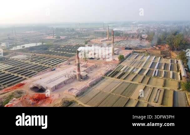 Large stacks pile of clay and red bricks in brick field which is ...