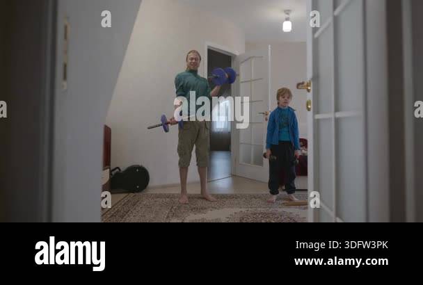 Man Does Exercise Workout with Kid at Home. 4K 10-bit Stock Video ...