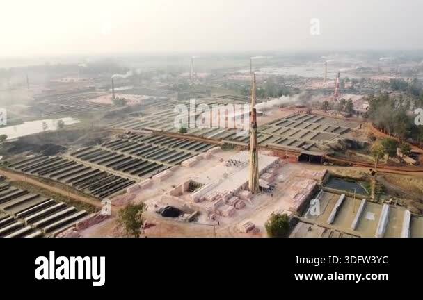 Large stacks pile of clay and red bricks in brick field which is ...