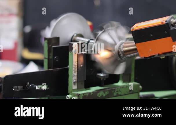 Turbocharger turbine wheel spinning rapidly on a dynamic balancing ...