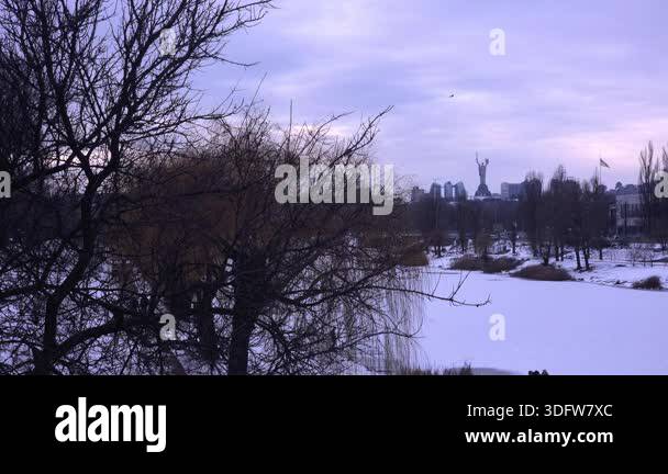 Beautiful winter landscape with a frozen river and the Kyiv city ...