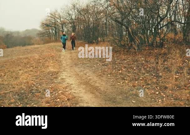 Healthy lifestyle jogging in autumn park. Concept of everyday fitness ...