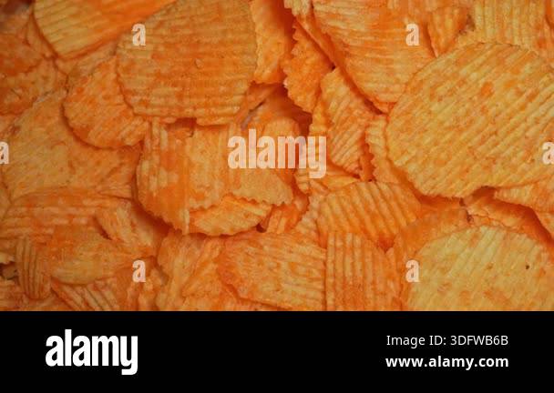 Crispy potato chips. Golden fried potatoes snack for unhealthy fast ...