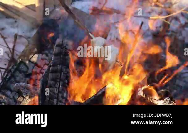 Winter Campfire Cooking: Preparing Lard over Open Fire in Snowy Outdoor ...