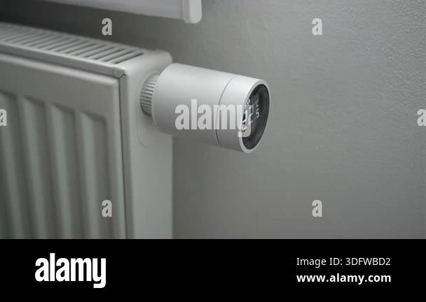 Smart thermostat screen showing current room temperature indoor climate ...