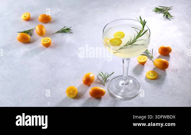 Elegant crystal glass with a refreshing alcoholic kumquat cocktail ...