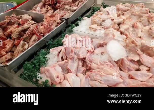 Fresh cuts of red meat and poultry, chicken and beef at the butcher ...