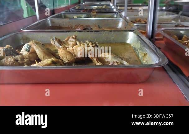 Activities at a typical Javanese Nasi Tegal stall, Indonesia, with a ...