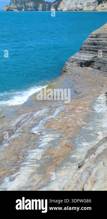 The peculiar forms of limestone rocks forming a coastal cliff above the ...