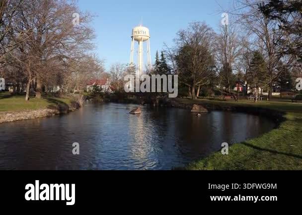 Perth, Canada -April 27, 2025: Park with river and water tower in Perth ...