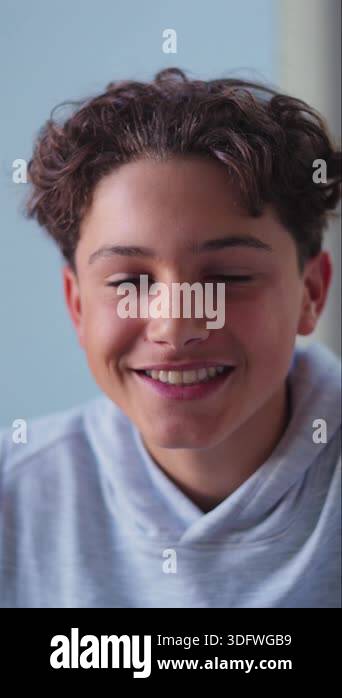 Child portrait with direct eye contact and gentle smile suggesting ...