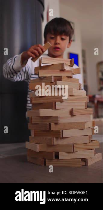 Child builds shorter block structure showing concentration persistence ...