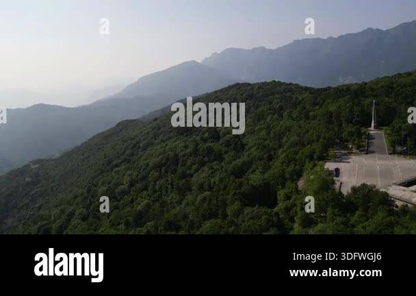 Lush green mountains under clear blue sky Stock Video Footage - Alamy