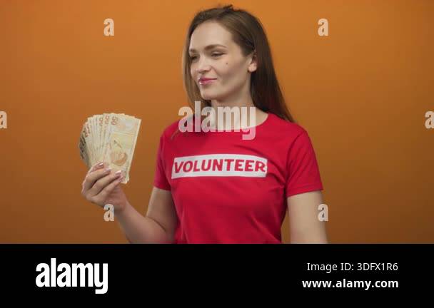 Young volunteer woman wearing volunteer tshirt holds fan of turkish ...